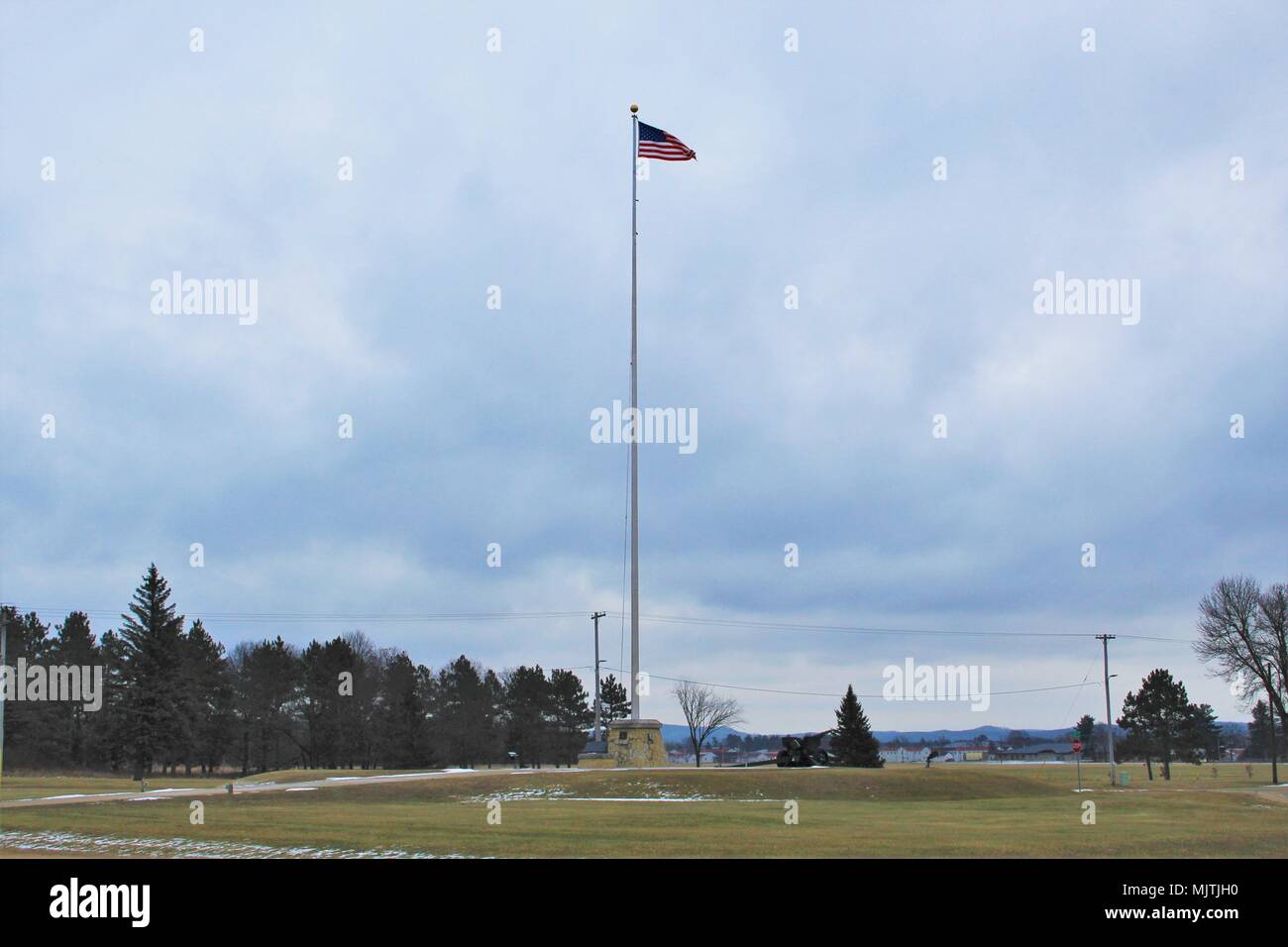 The flag of the United States of America is brightened by a backdrop of ...