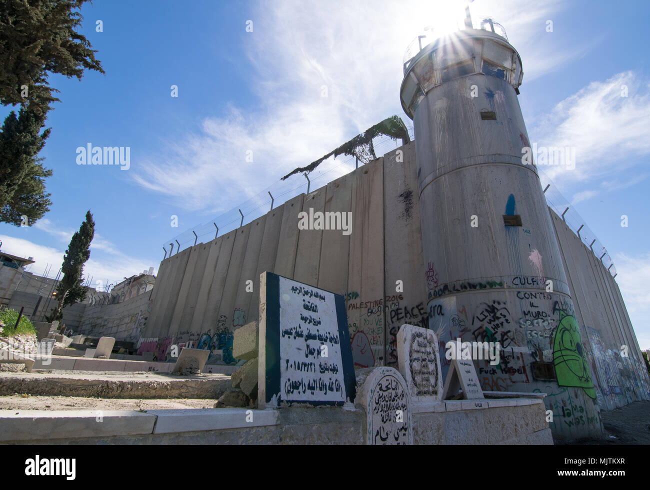 Cemetery near the Israeli West Bank barrier Stock Photo - Alamy