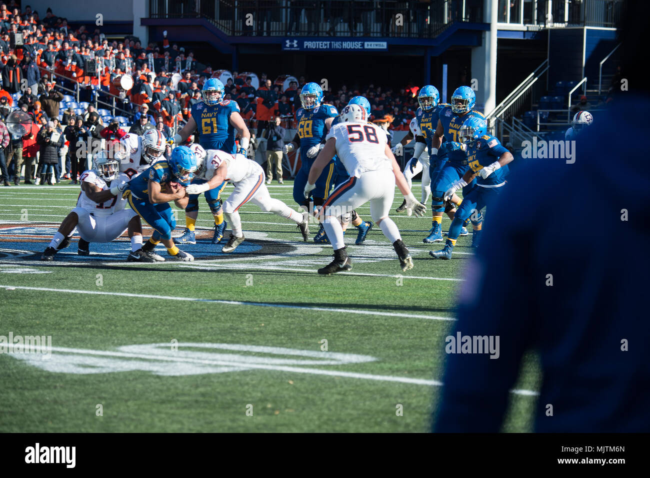 Navy Quarterback Malcolm Perry prepares for the incoming tackles during ...