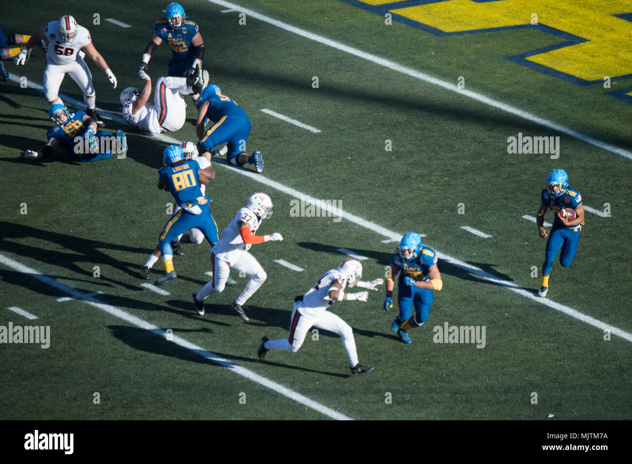 Navy Quarterback Malcolm Perry, 10, scrambles during the 2017 Military ...