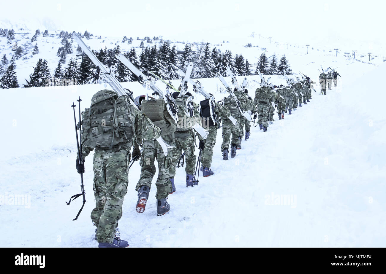 An Alpine patrol of American and Italian paratroopers moves into the ...
