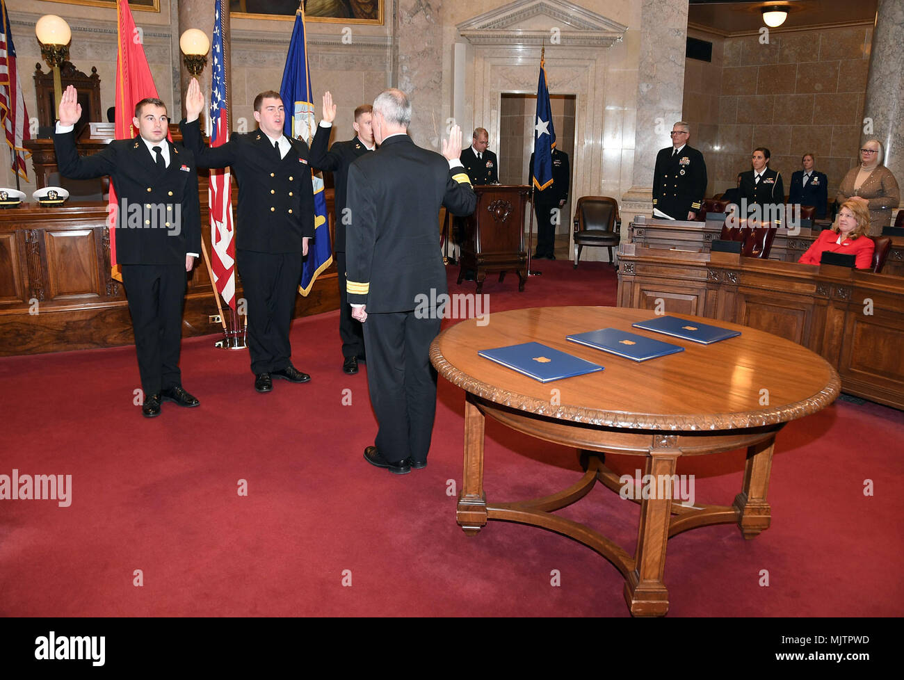 Administers the oath of office to three university of wisconsin hi-res ...