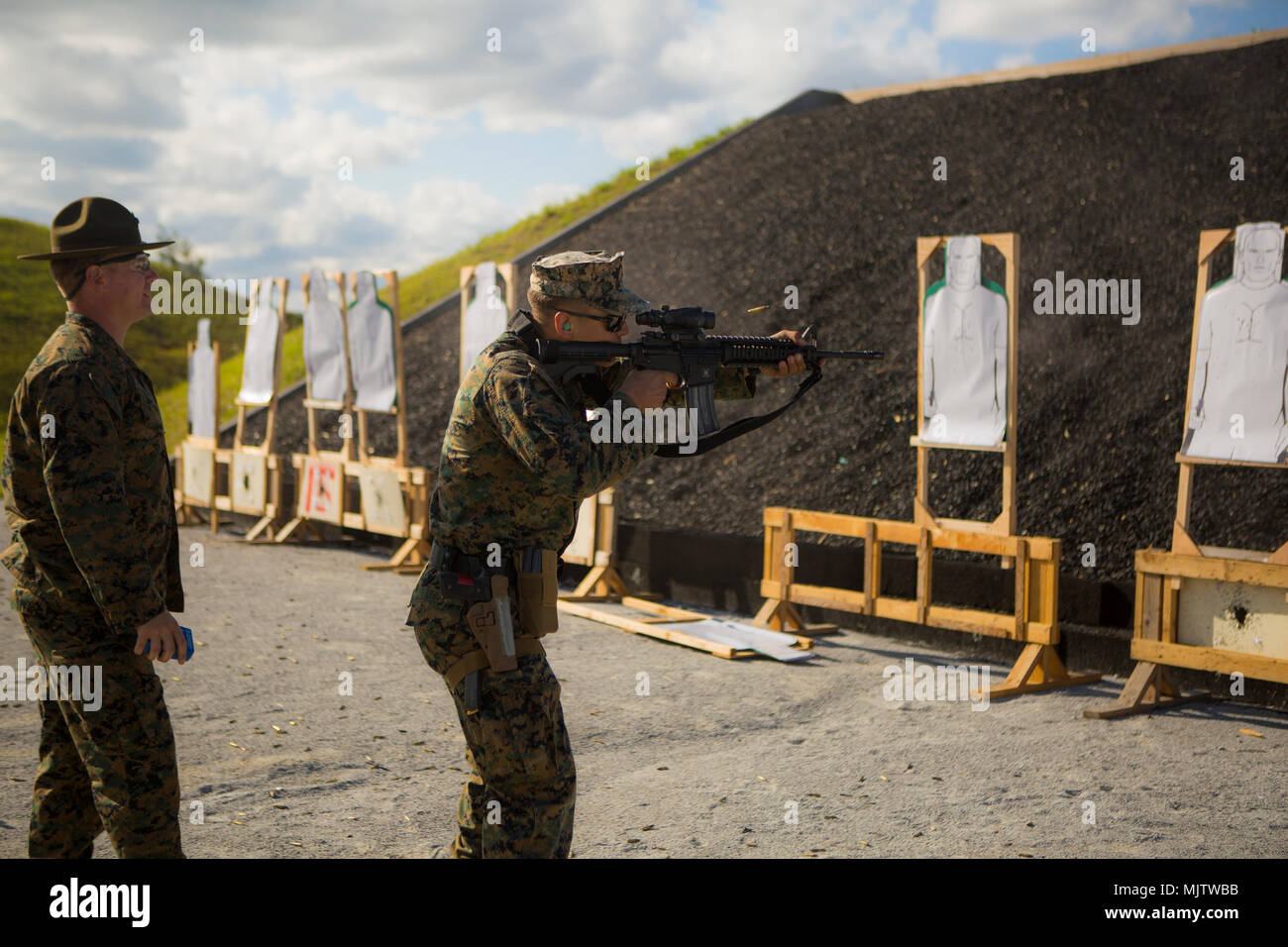 CAMP HANSEN, OKINAWA, Japan— Lance Cpl. Raymond Lemus fires his M16A4 ...