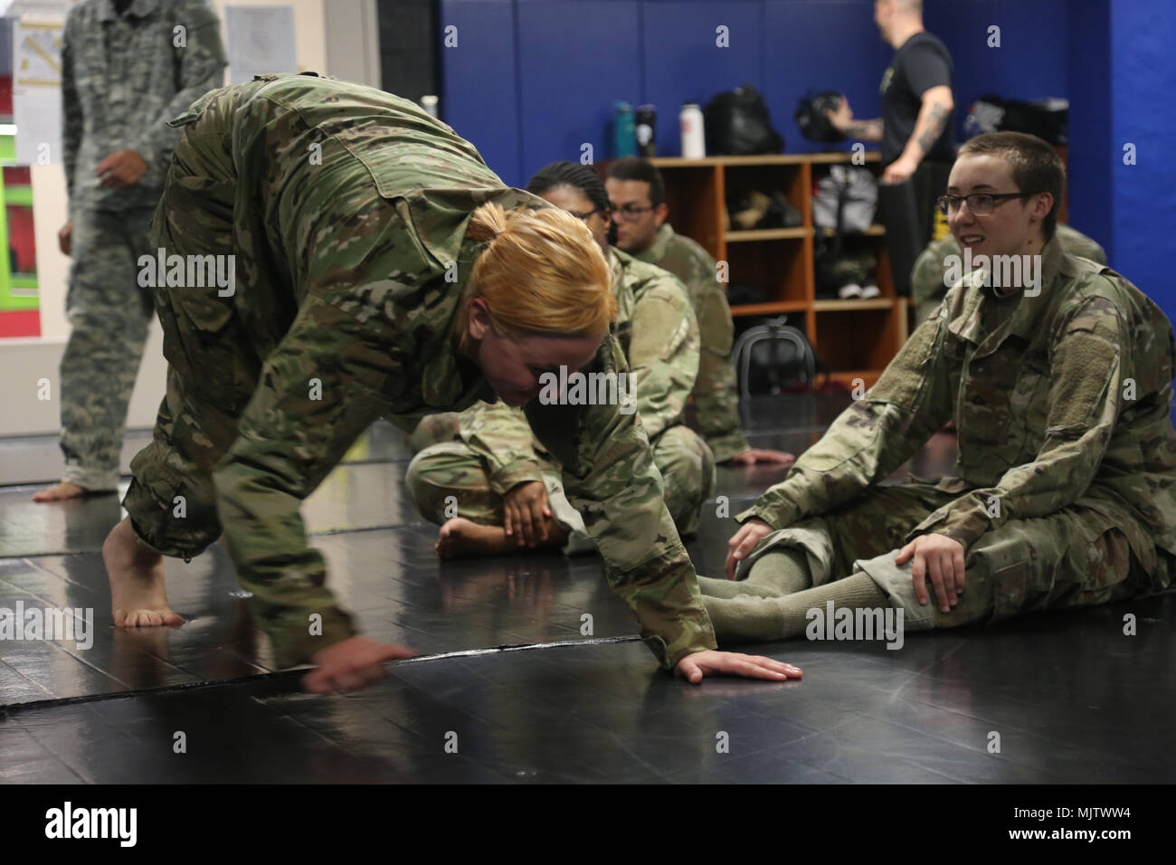 U.S. Army Pfc. Caitlyn Cassidy, (left) assigned to the 55th Signal ...