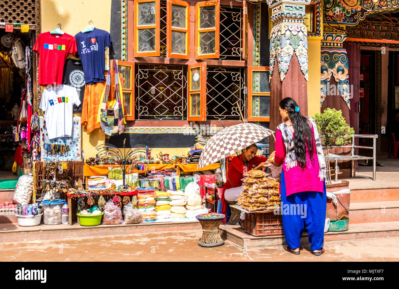 Shop keepers attending their premises on the streets of Boudhanath ...