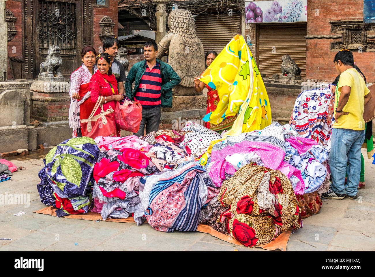 Selling textile cloth on streets of Kathmandu Nepal Stock Photo - Alamy