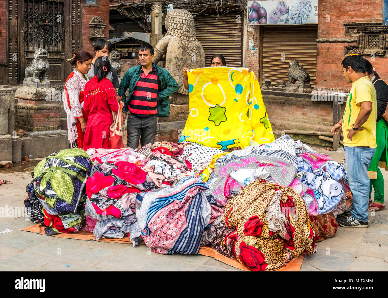 Selling textile cloth on streets of Kathmandu Nepal Stock Photo - Alamy