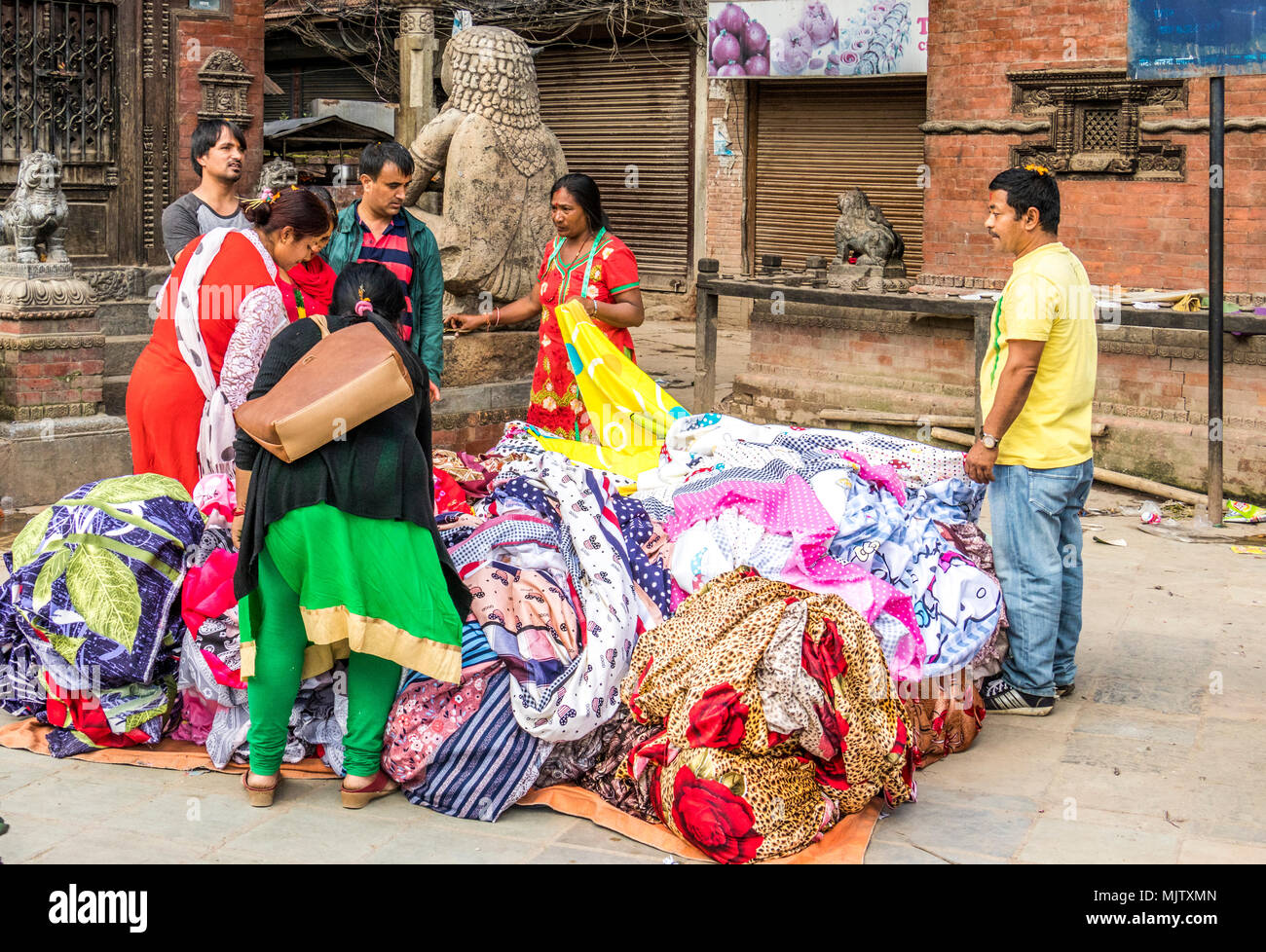 Selling textile cloth on streets of Kathmandu Nepal Stock Photo - Alamy