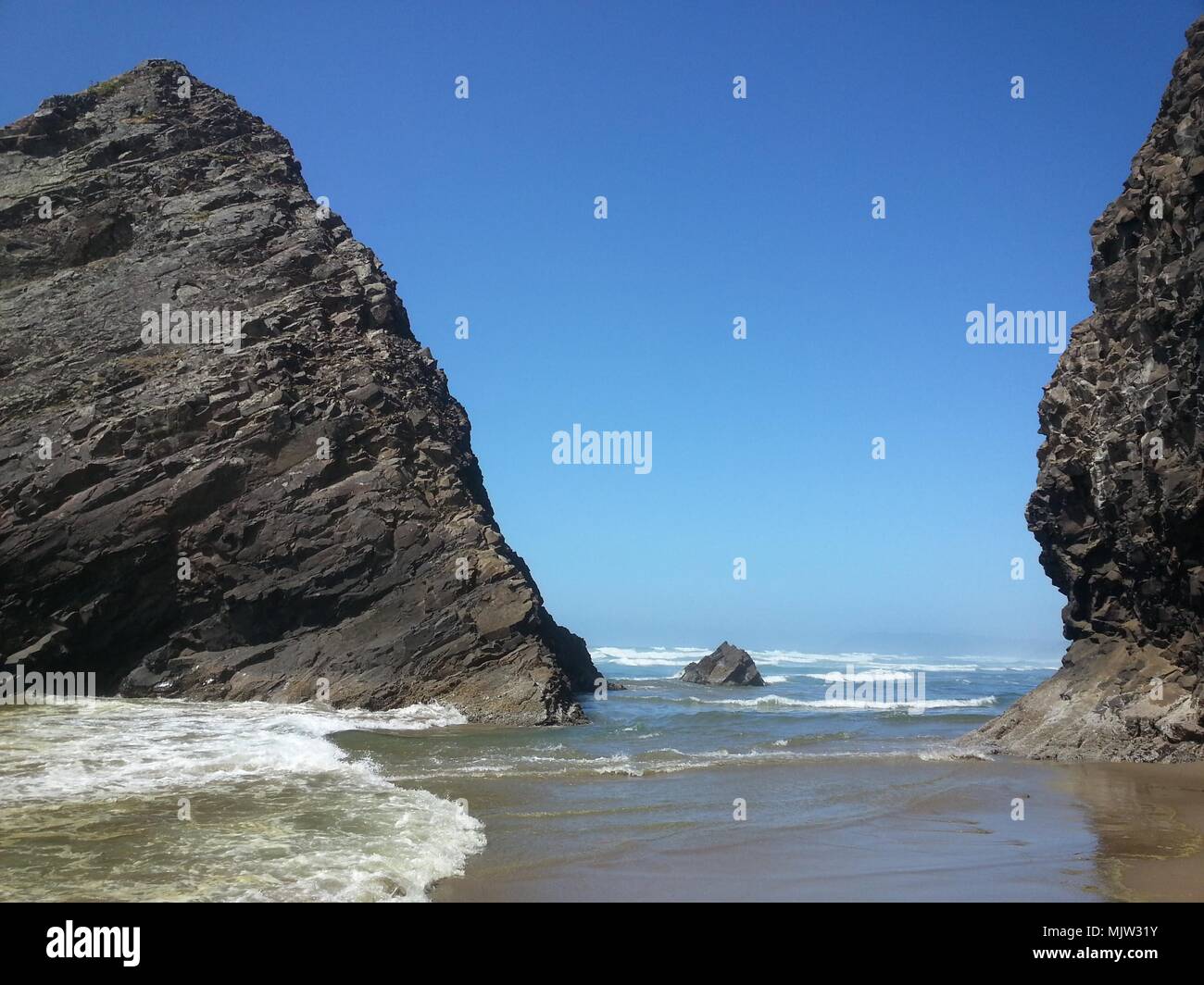 A beautiful clear day and blue sky on the coast of Arch Cape , Oregon ...