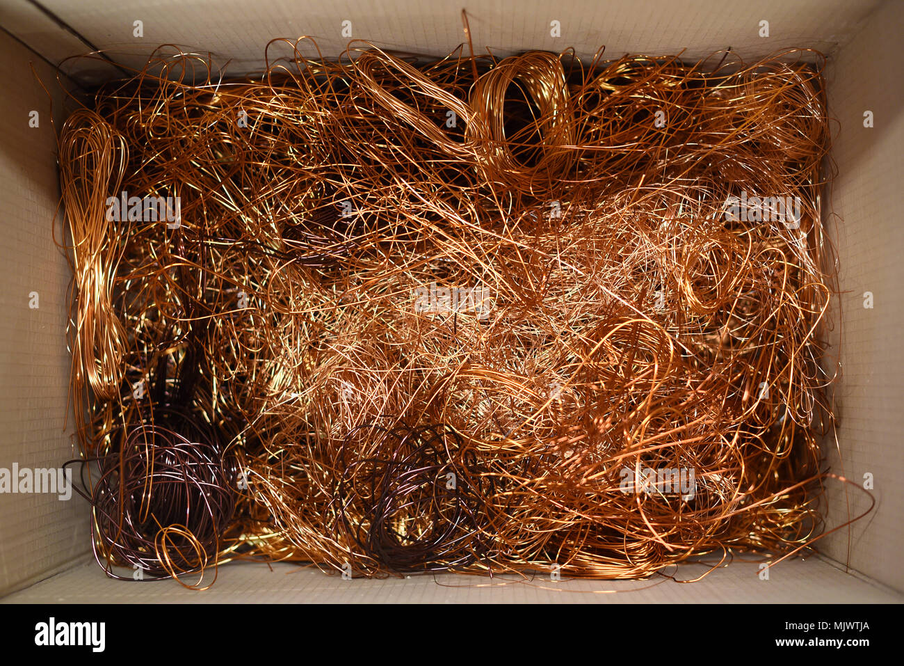 Waste copper from cables in a container in a factory ready to be ...