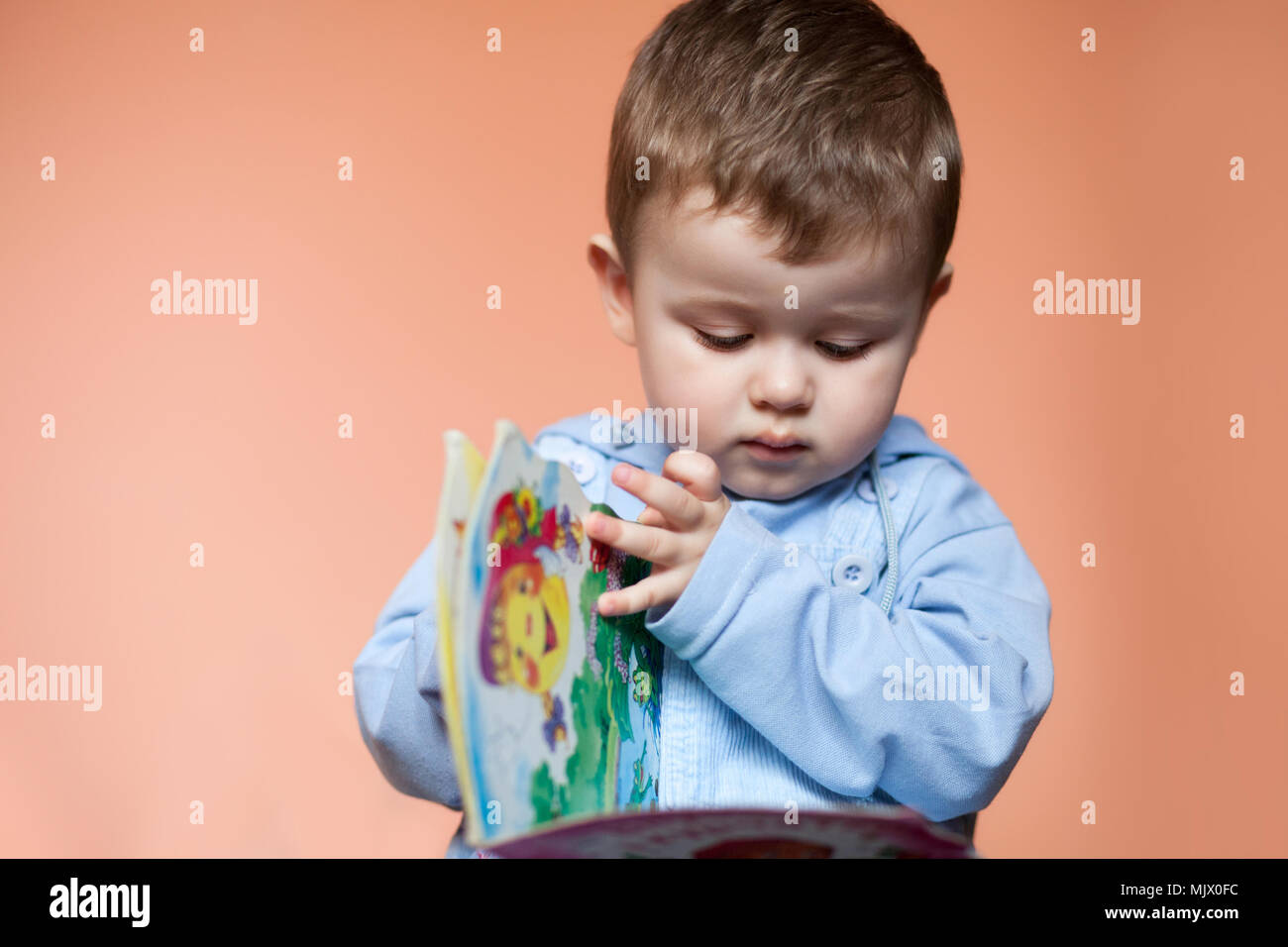 Portrait little boy with a book. Cute boy study and reading book Stock ...