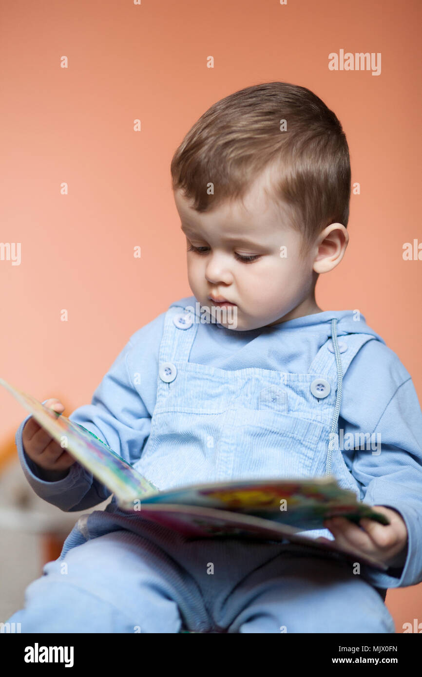 Portrait little boy with a book. Cute boy study and reading book Stock ...