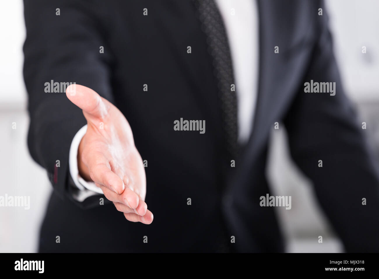Businessman stretching open hand offering handshake and inviting to ...