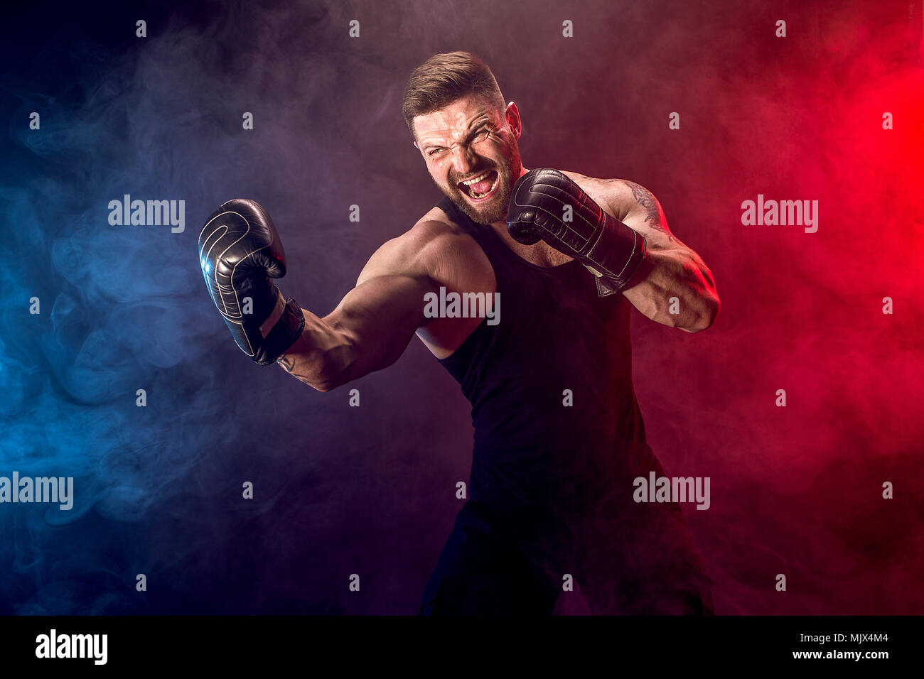 Sport concept. Sportsman muay thai boxer fighting on black background ...