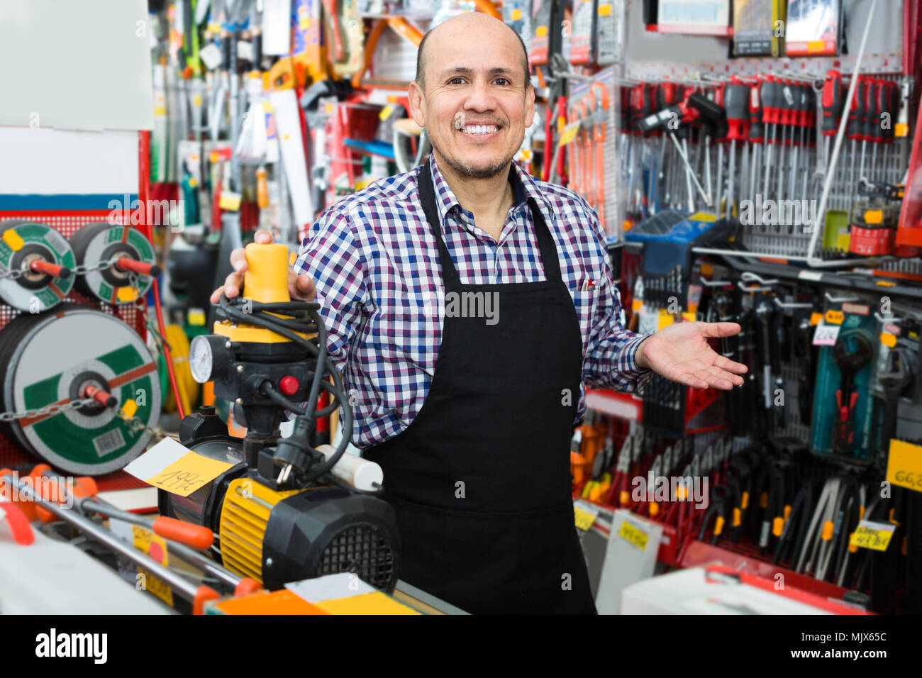 Professional salesman offering modern electric pump Stock Photo - Alamy