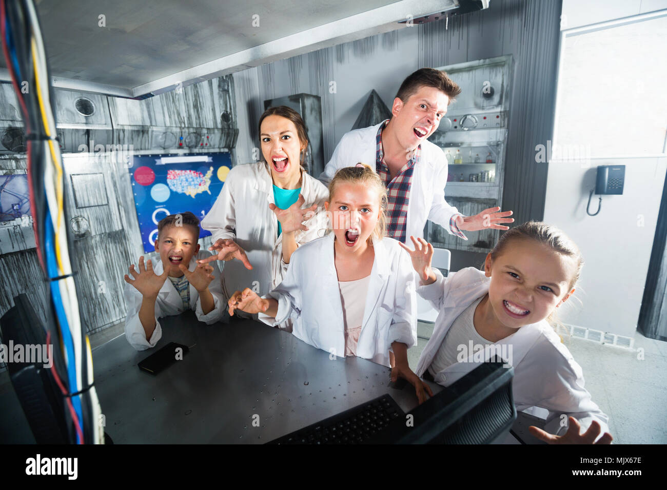 Happy positive family of five is depisting madness in time having fun ...