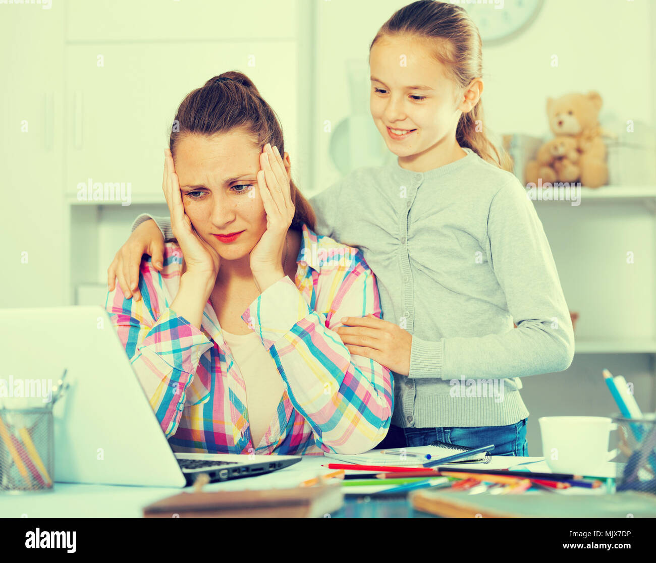 Irritated mother watching at the mistakes her daughter's homework Stock ...