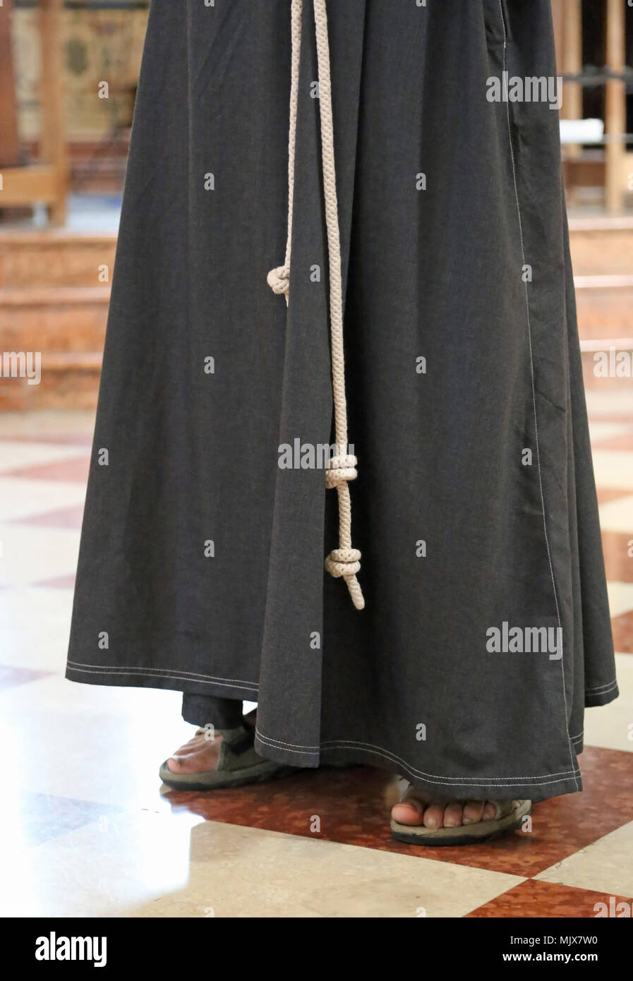 barefoot monk with sandals in the church Stock Photo - Alamy