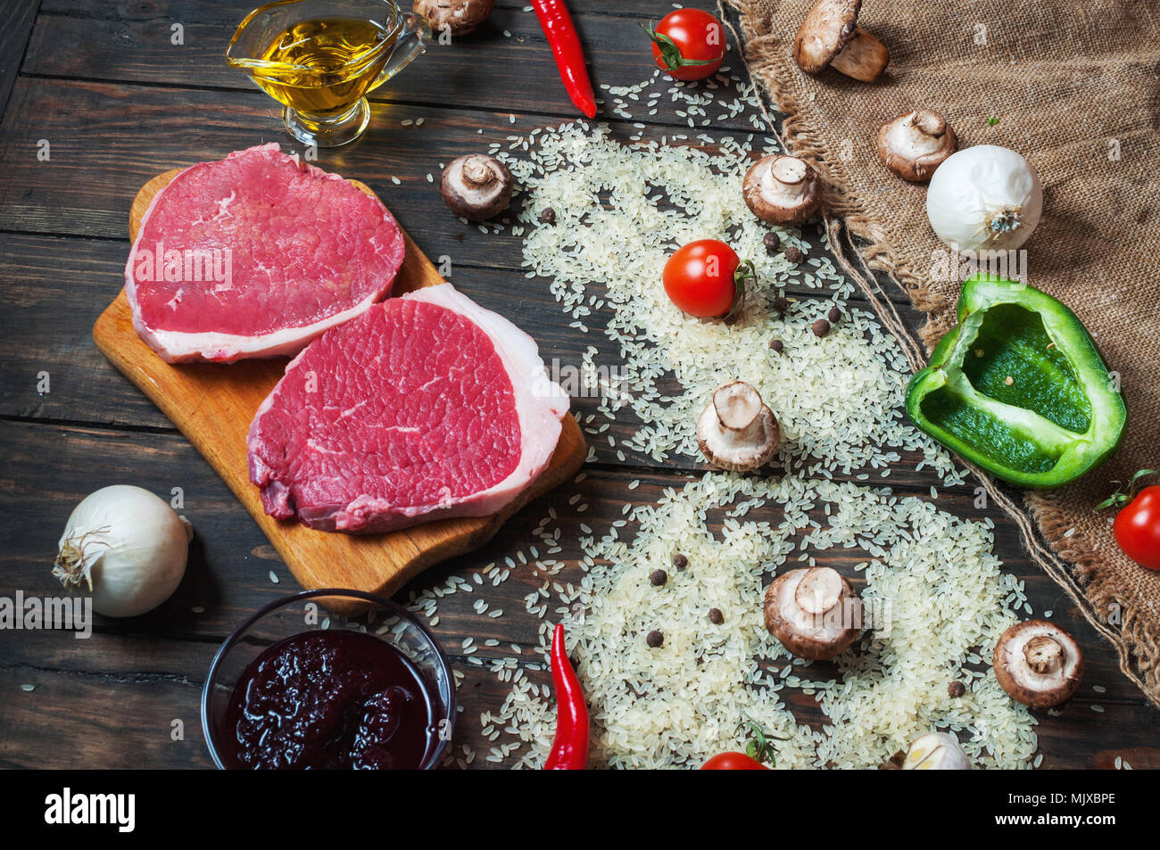 Ingredients for cooking healthy meat dinner. Raw uncooked beef rib eye ...