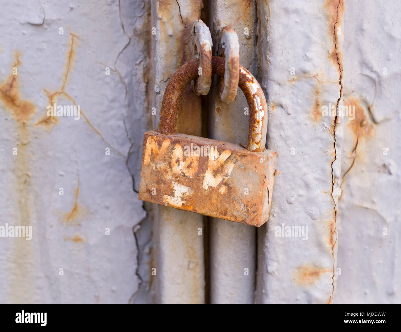 rusty lock on gray weathered door. object, background Stock Photo - Alamy