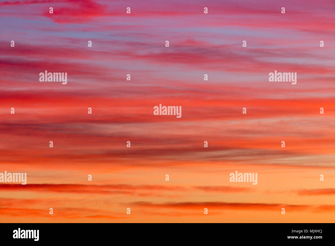 Clouds and jet vapor trails creating beautiful, colorful texture Stock ...