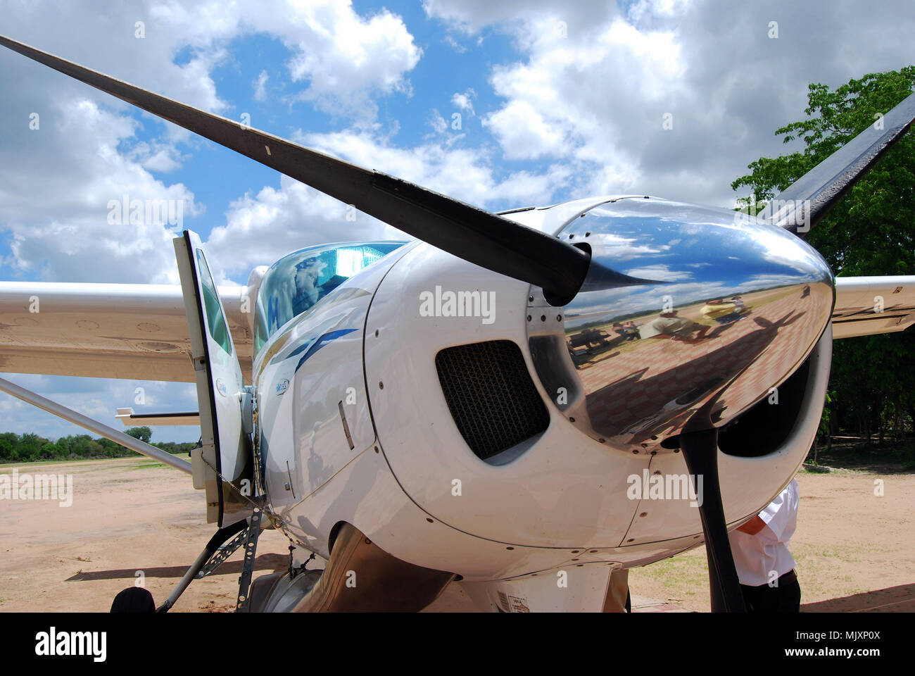 A light aircraft on an airstrip ferrying tourists to and from remote ...