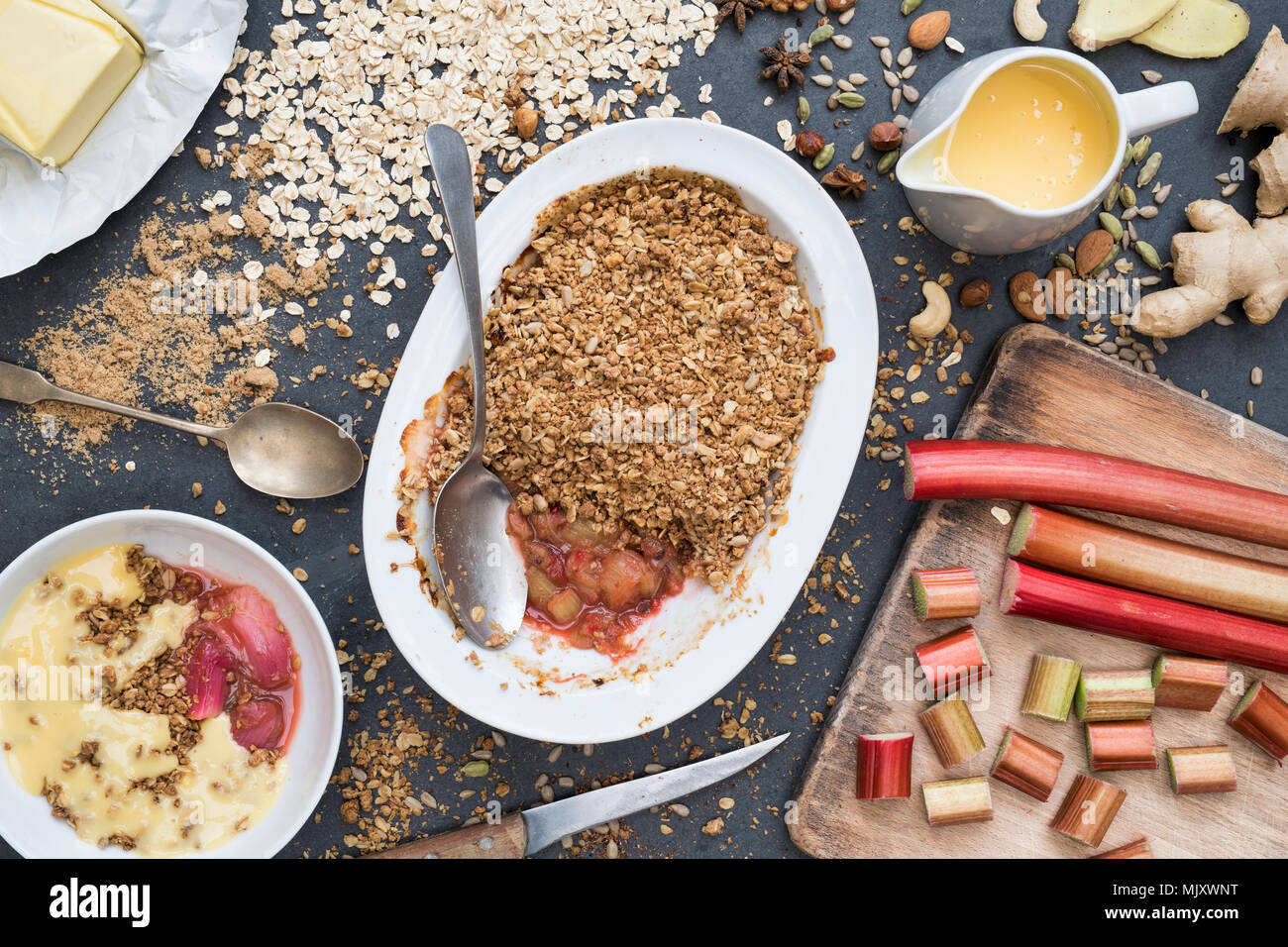 Homemade spiced rhubarb crumble and custard. UK Stock Photo - Alamy