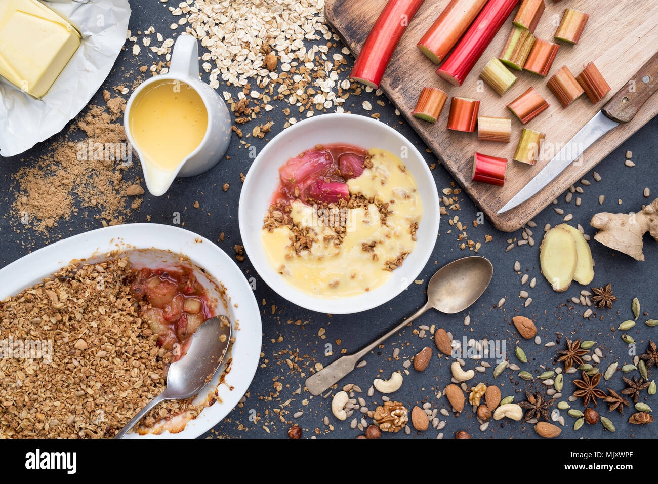 Homemade spiced rhubarb crumble and custard. UK Stock Photo - Alamy