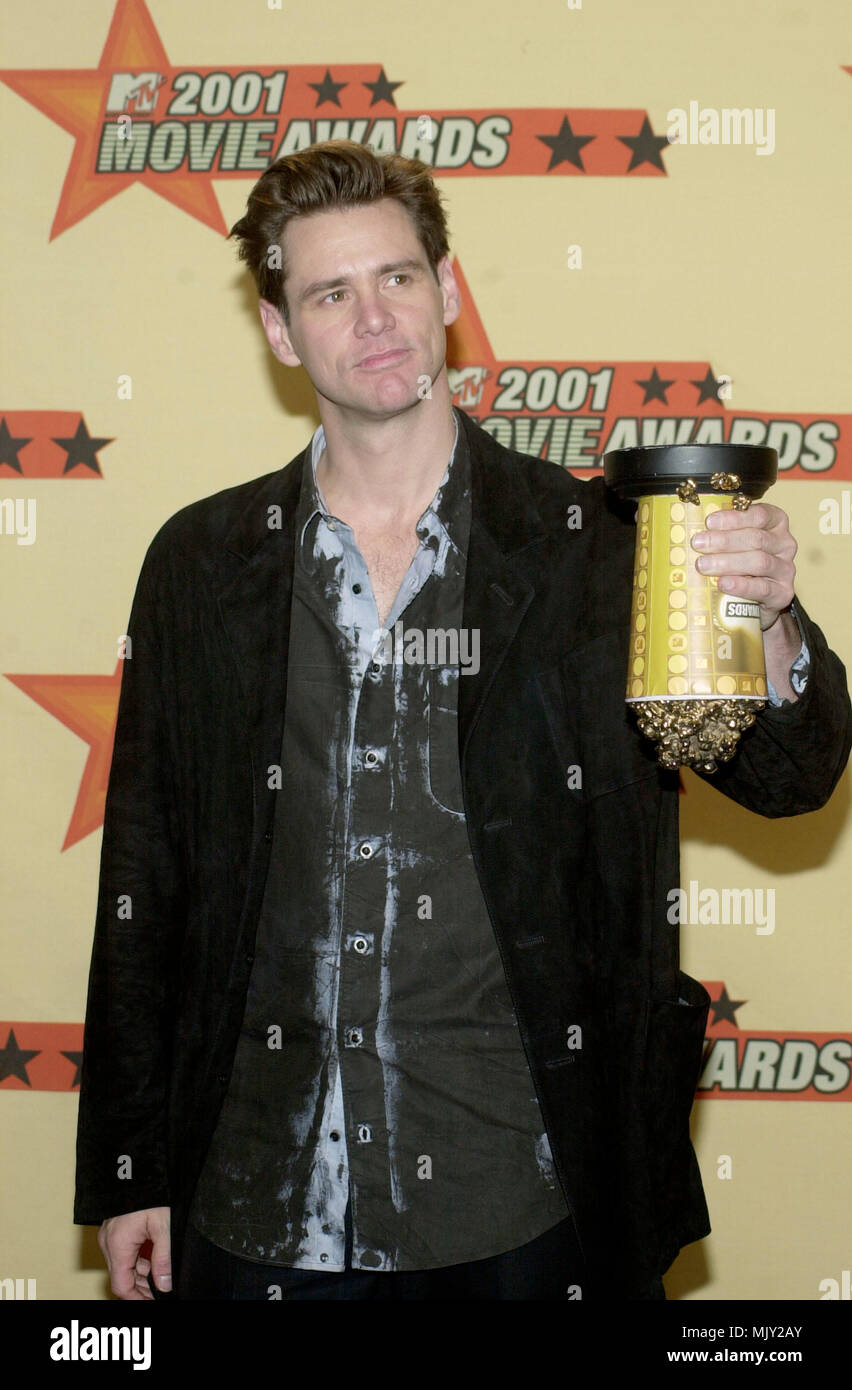 Jim Carrey with his award for Best Comedic performance backstage at the ...