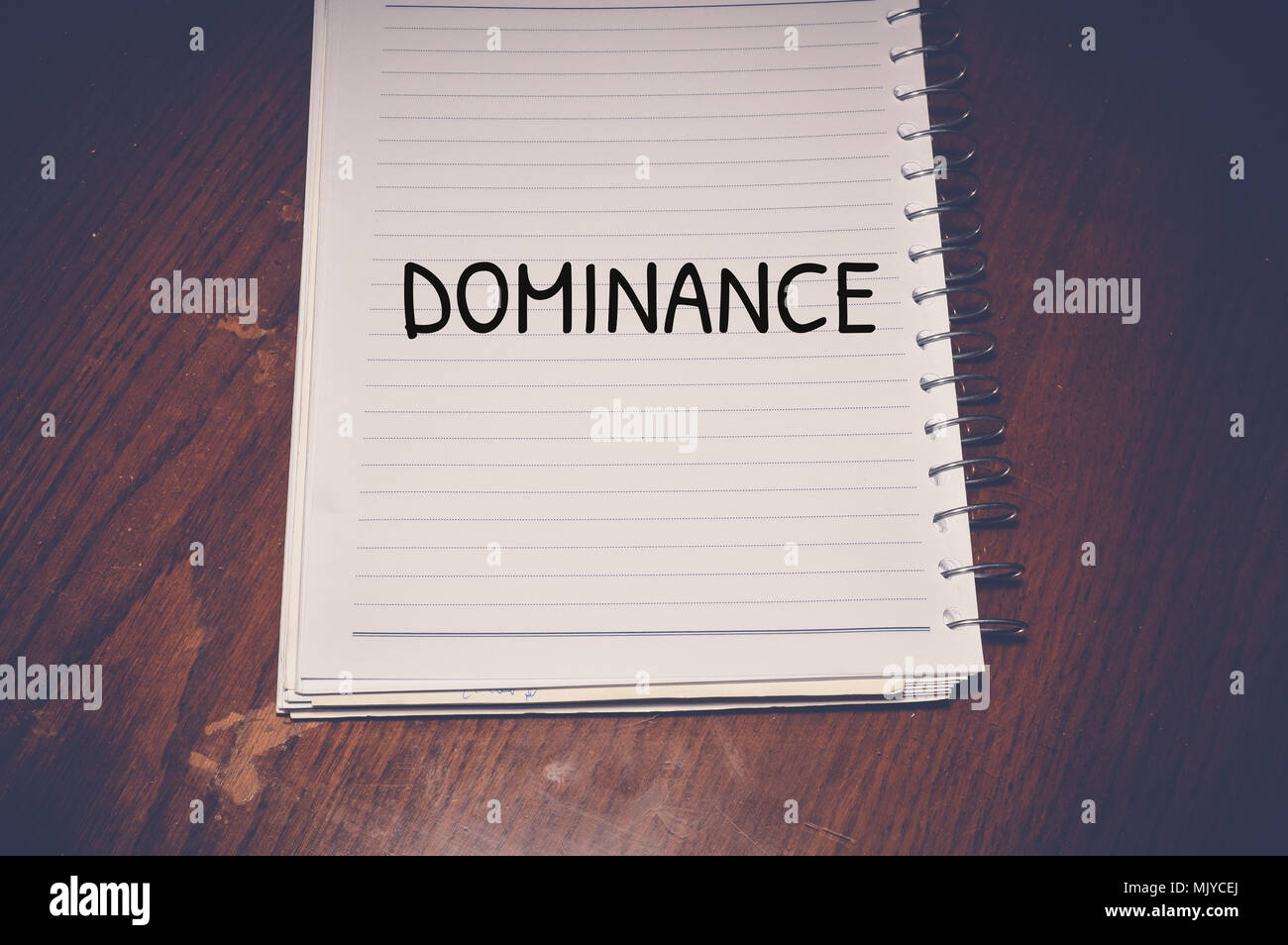 Dominance word written on white paper Stock Photo - Alamy