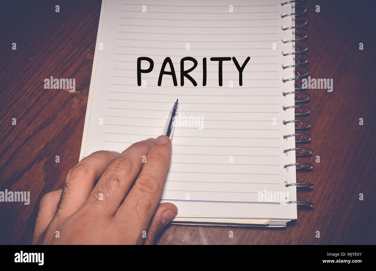 Parity word written on white paper Stock Photo - Alamy