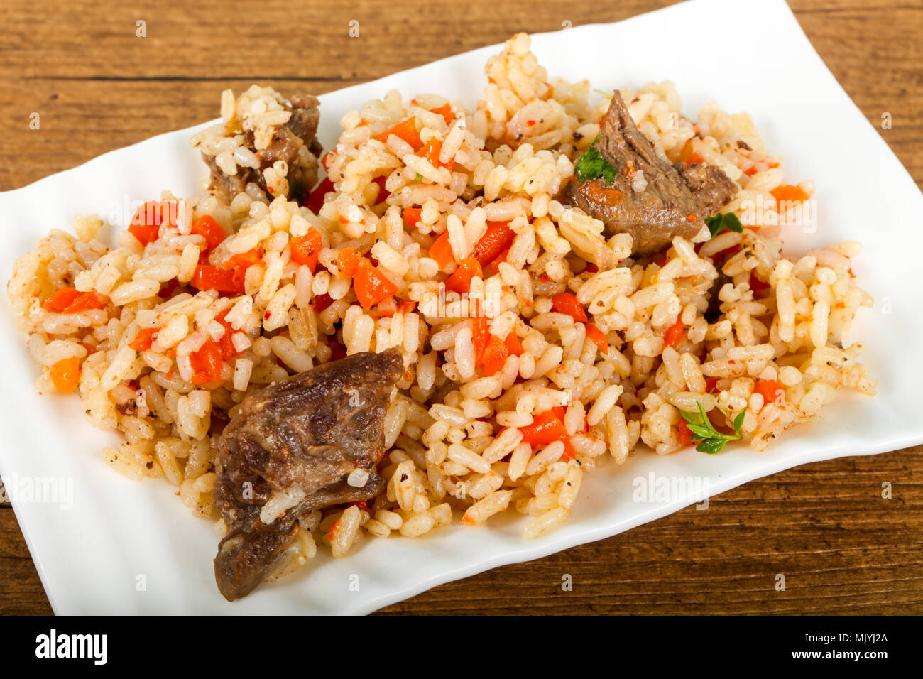 Asian rice - Plov with meat and carrot Stock Photo - Alamy