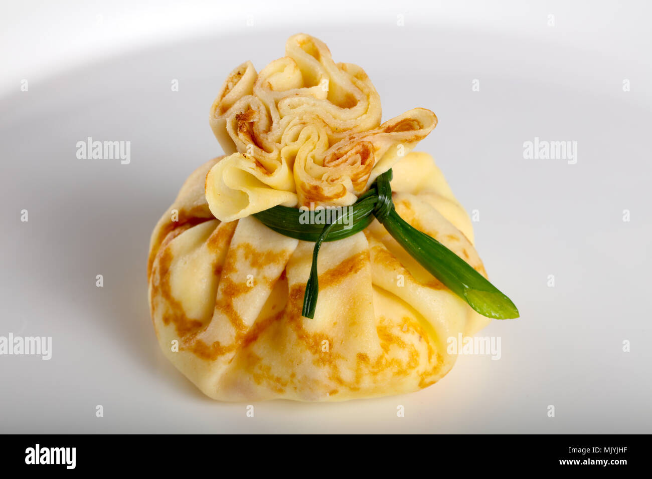 Stuffed pancake bags with meat and onion Stock Photo - Alamy