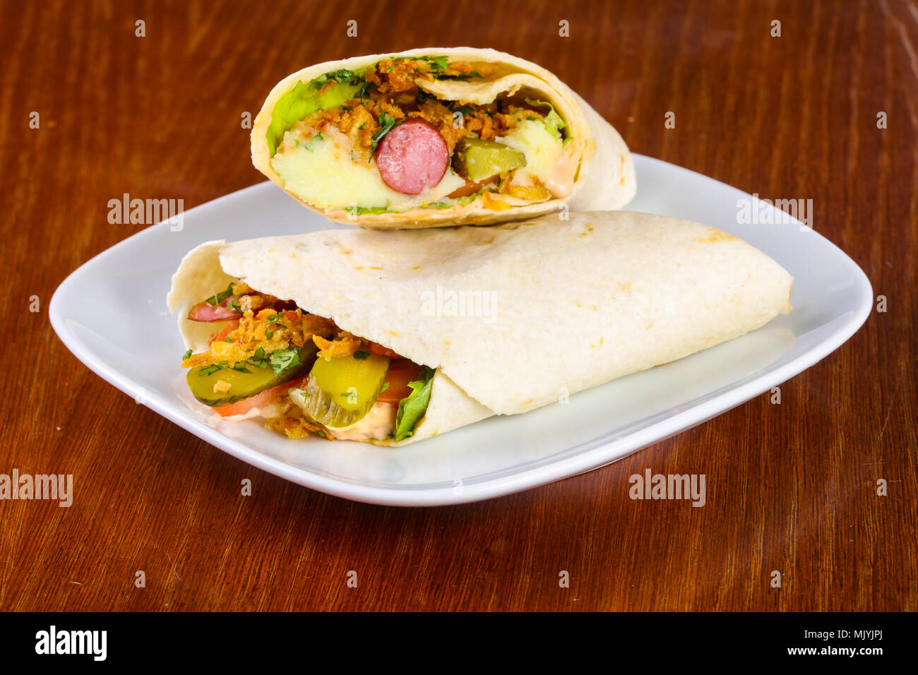 Tortilia with saucage and cucumber Stock Photo - Alamy