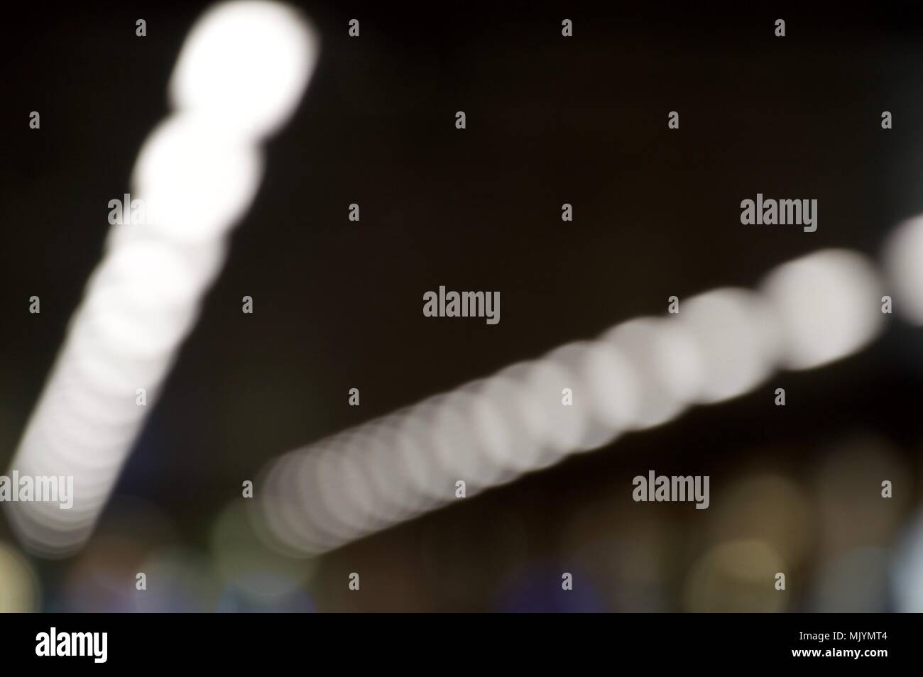 White lights with bokeh effect on dark background Stock Photo - Alamy