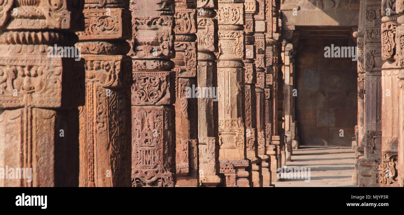 Carved stone columns in 12th century Quwwat-ul-Islam mosque in Delhi ...