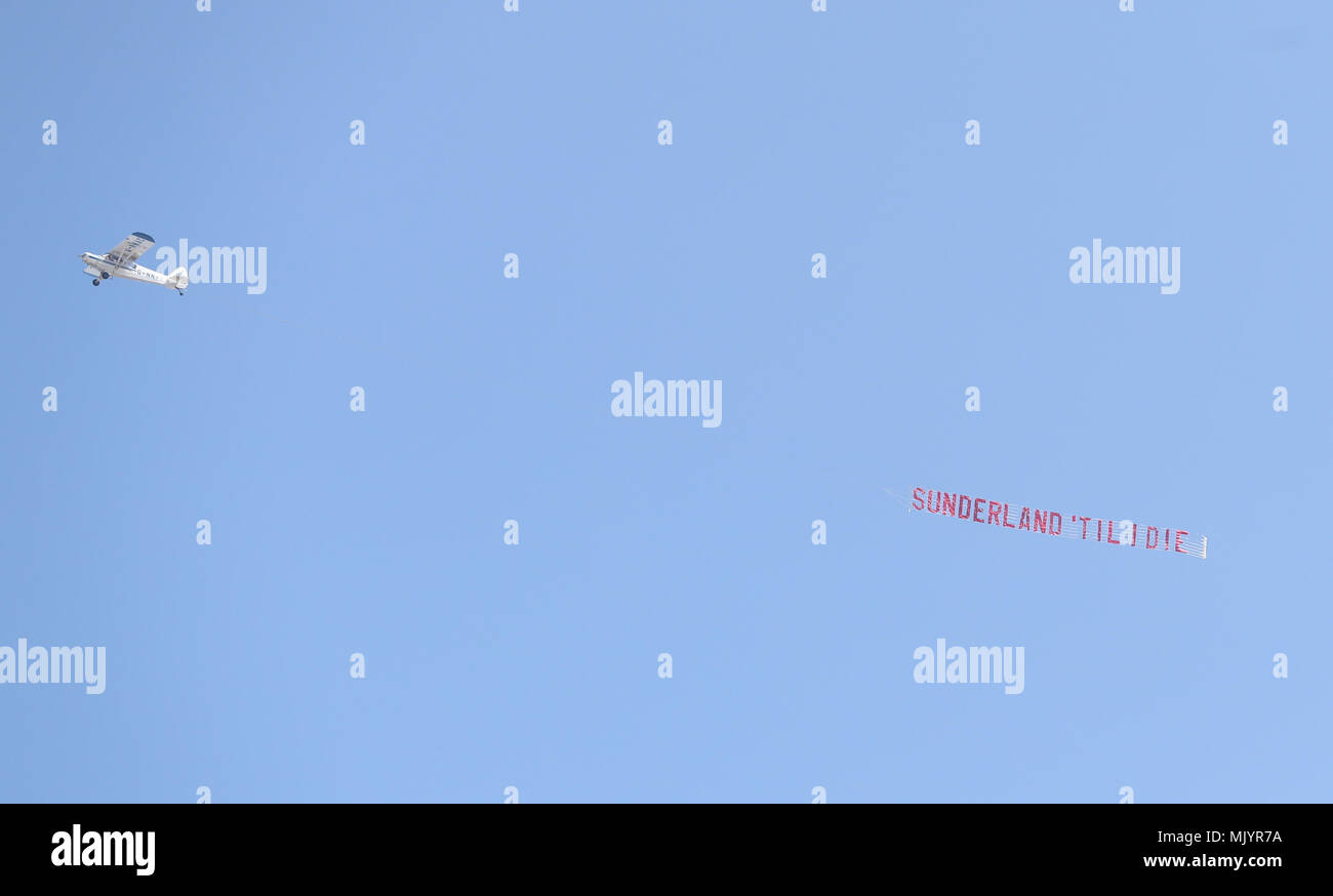 A plane flies over the stadium with a banner reading "Sunderland 'Til I ...