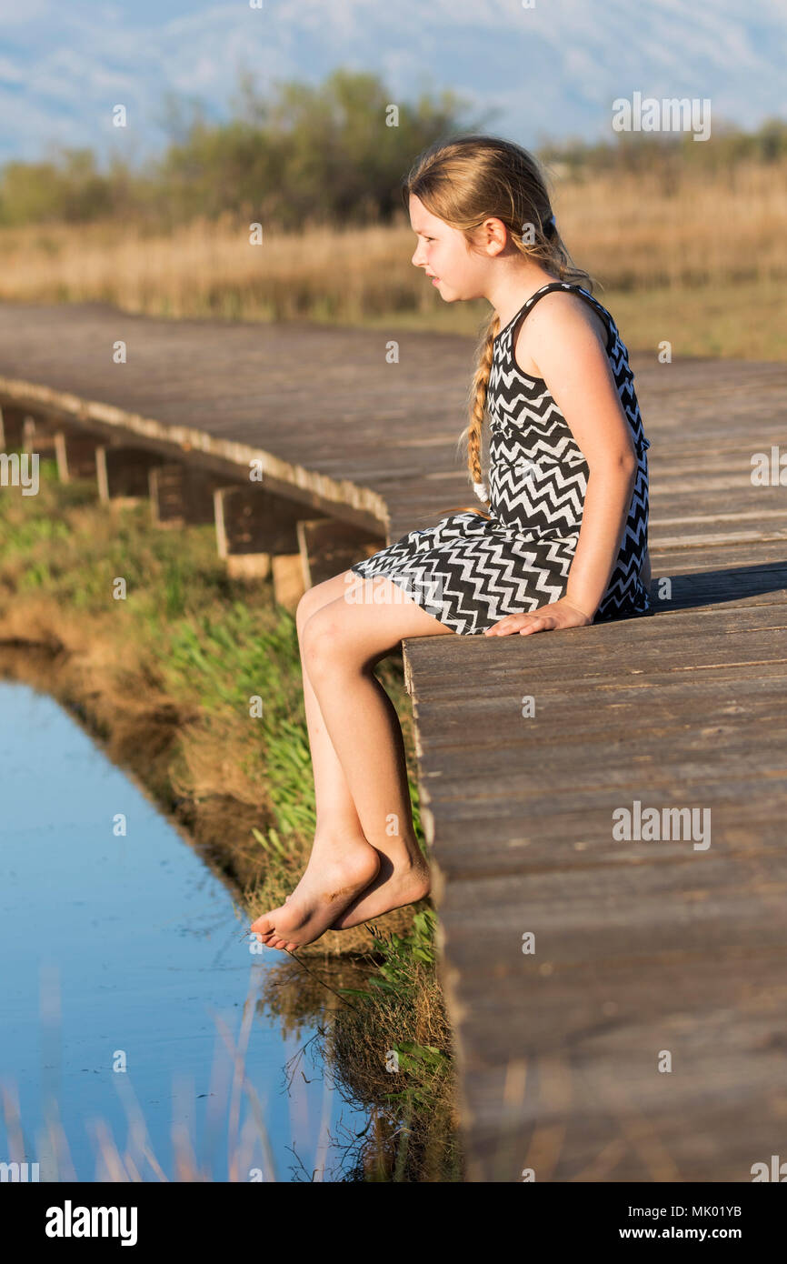 Young girl on a wooden path, Nin, Croatia Stock Photo - Alamy