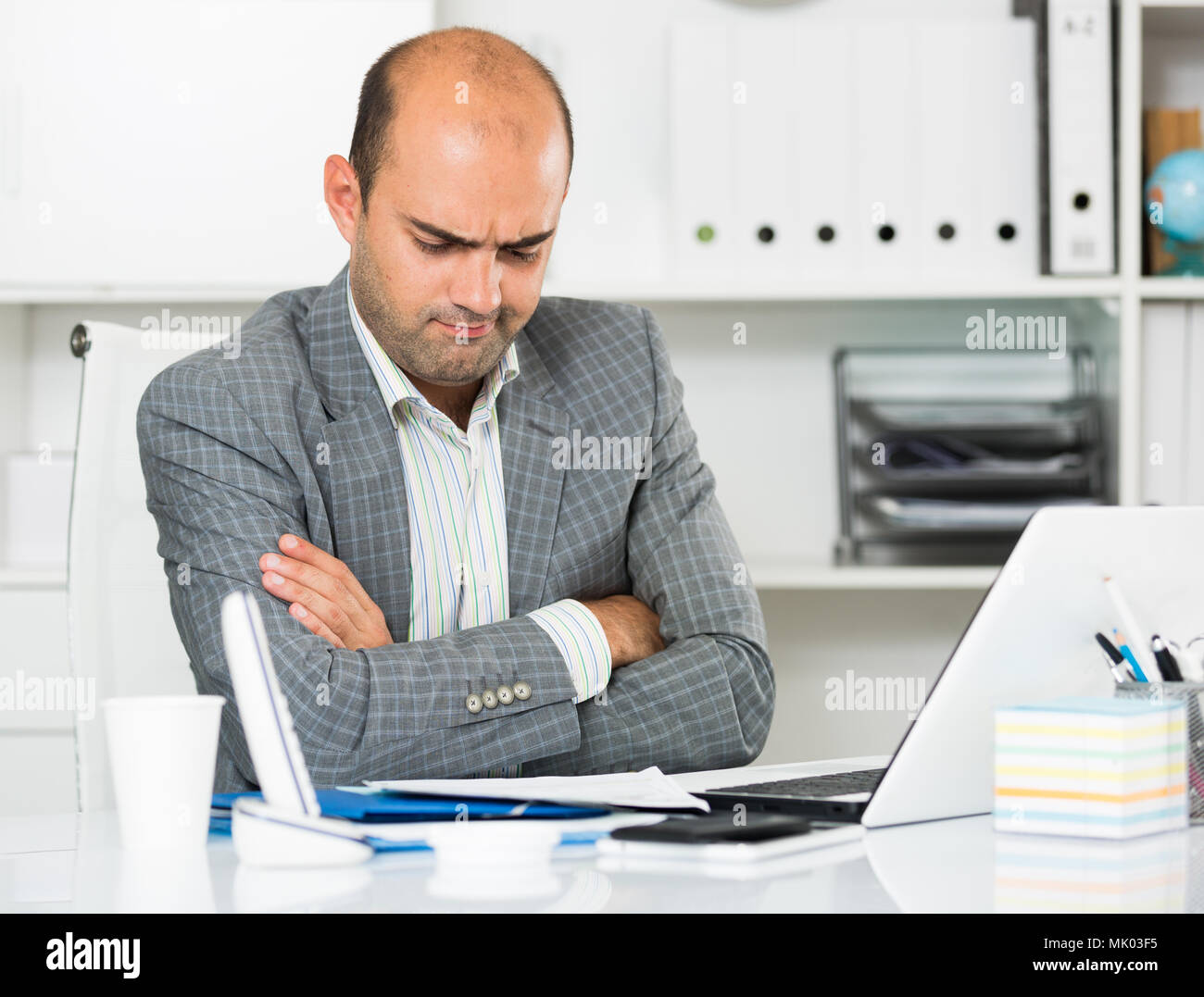 Busy businessman in shirt worrying and thinking at the computer Stock ...
