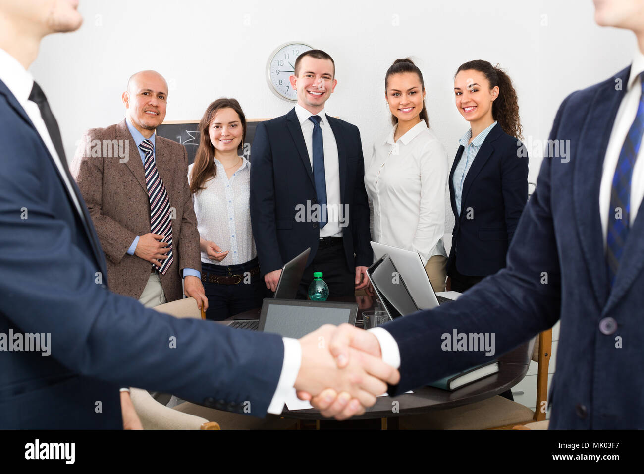 Handshake between two managers at meeting in office Stock Photo - Alamy