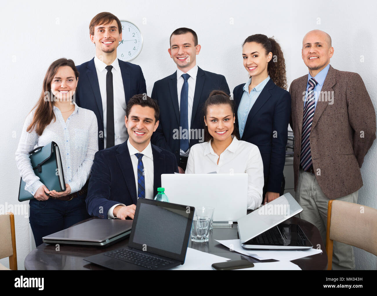 Portrait of smiling corporate managers in office interior Stock Photo ...