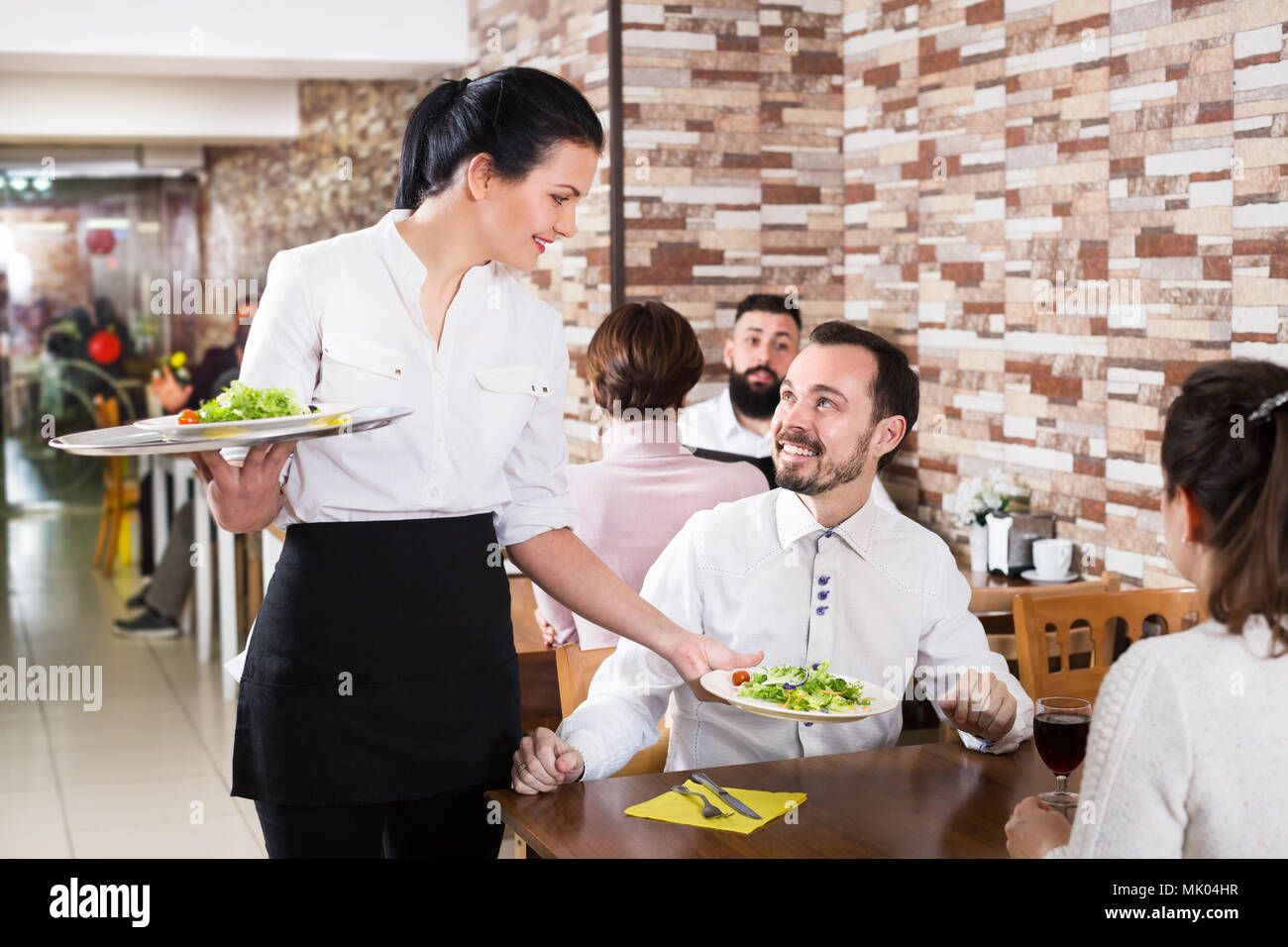 Restaurant Waitress At Table