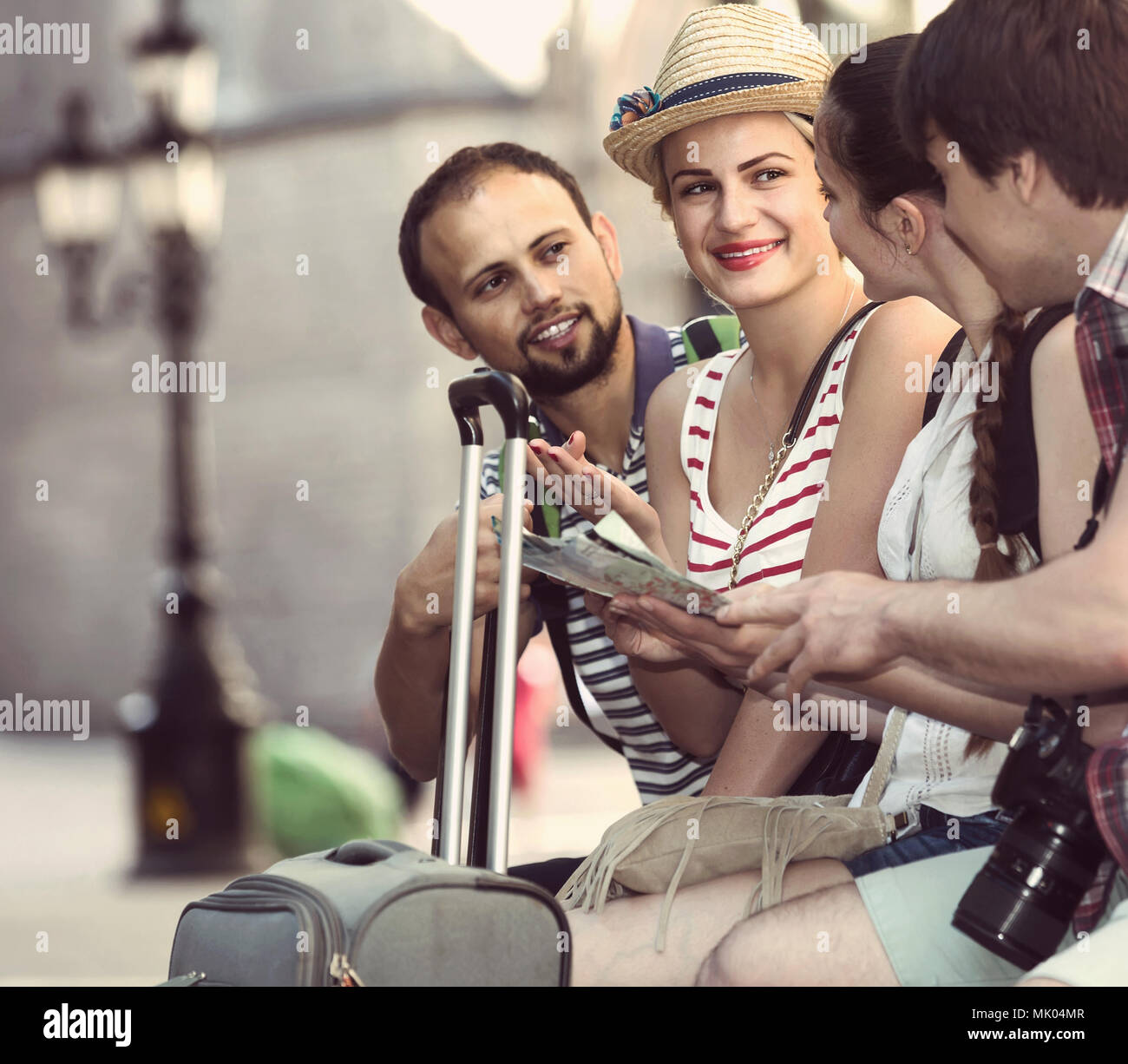 smiling american tourists with map exploring the city destination Stock ...