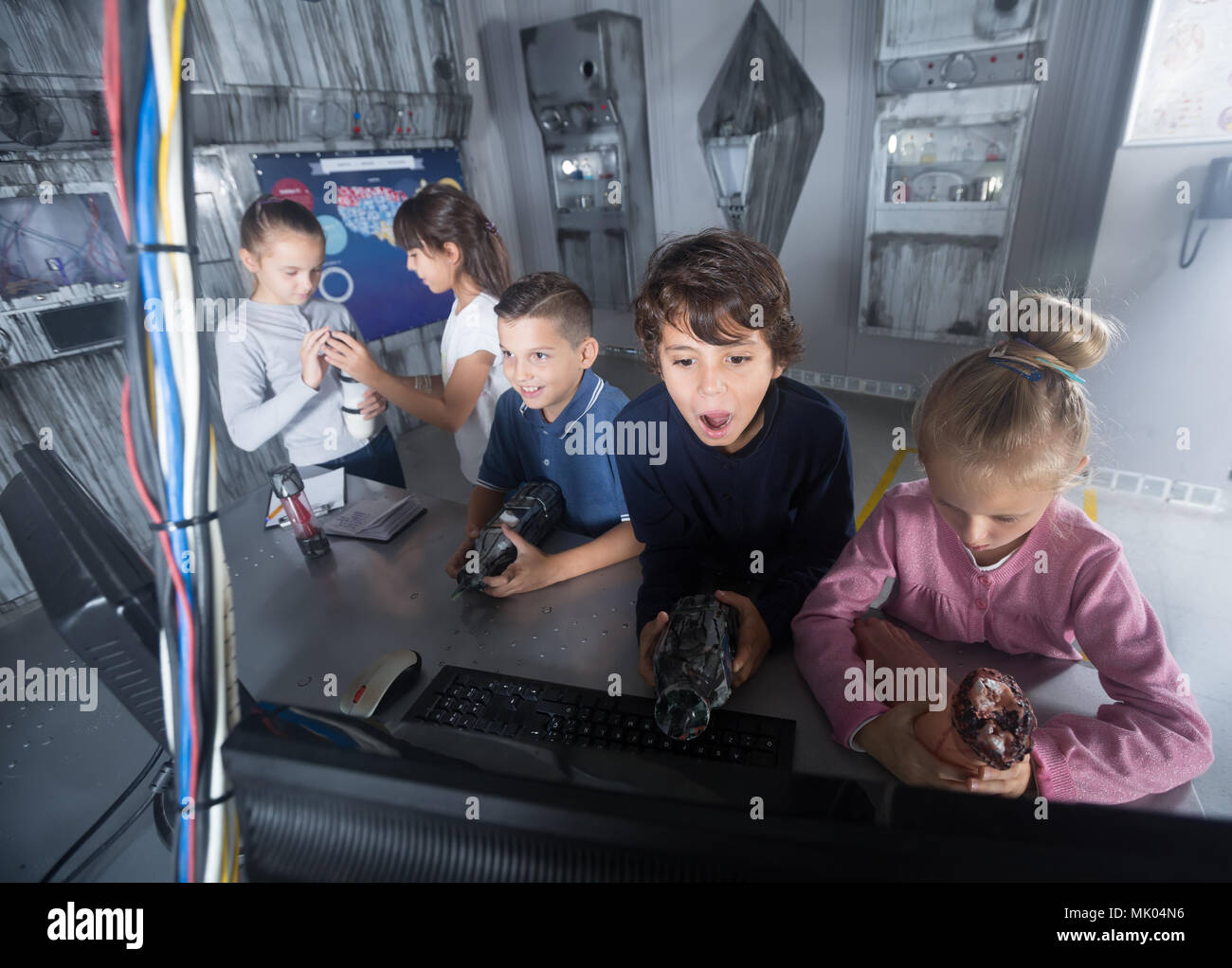 five kids playing in bunker quest room Stock Photo - Alamy