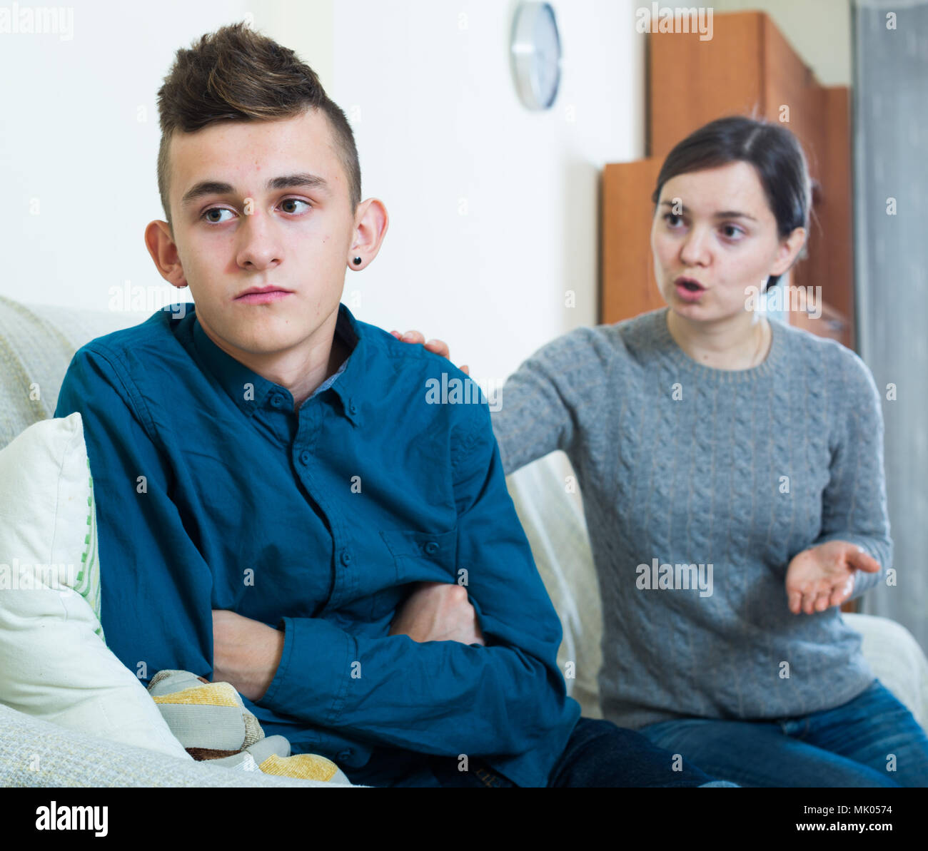 Home portrait of soft character woman and offended teen Stock Photo - Alamy