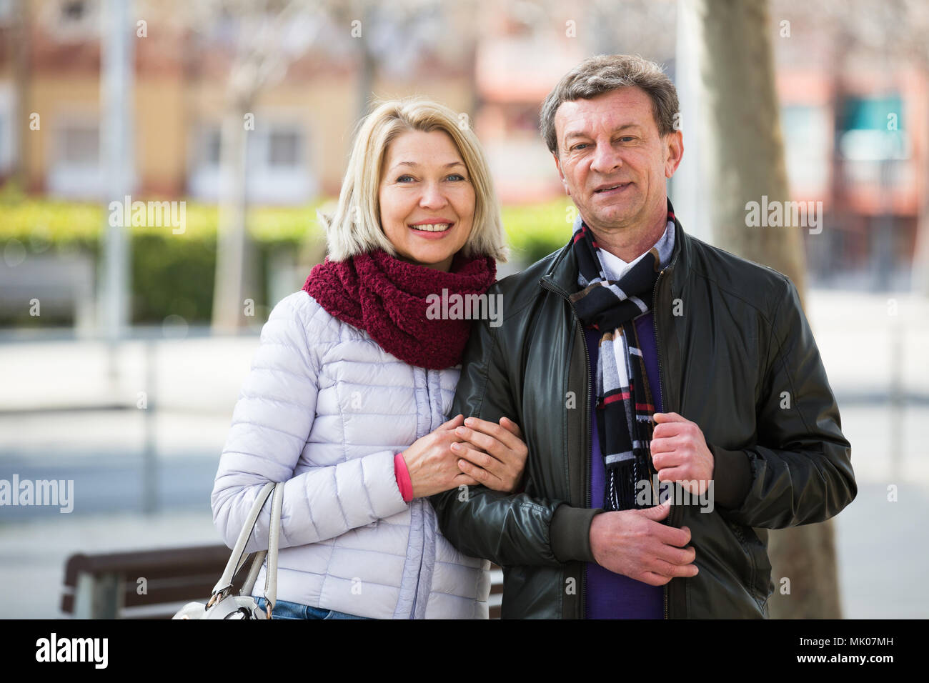 Loving mature man and woman having walk together in spring Stock Photo ...