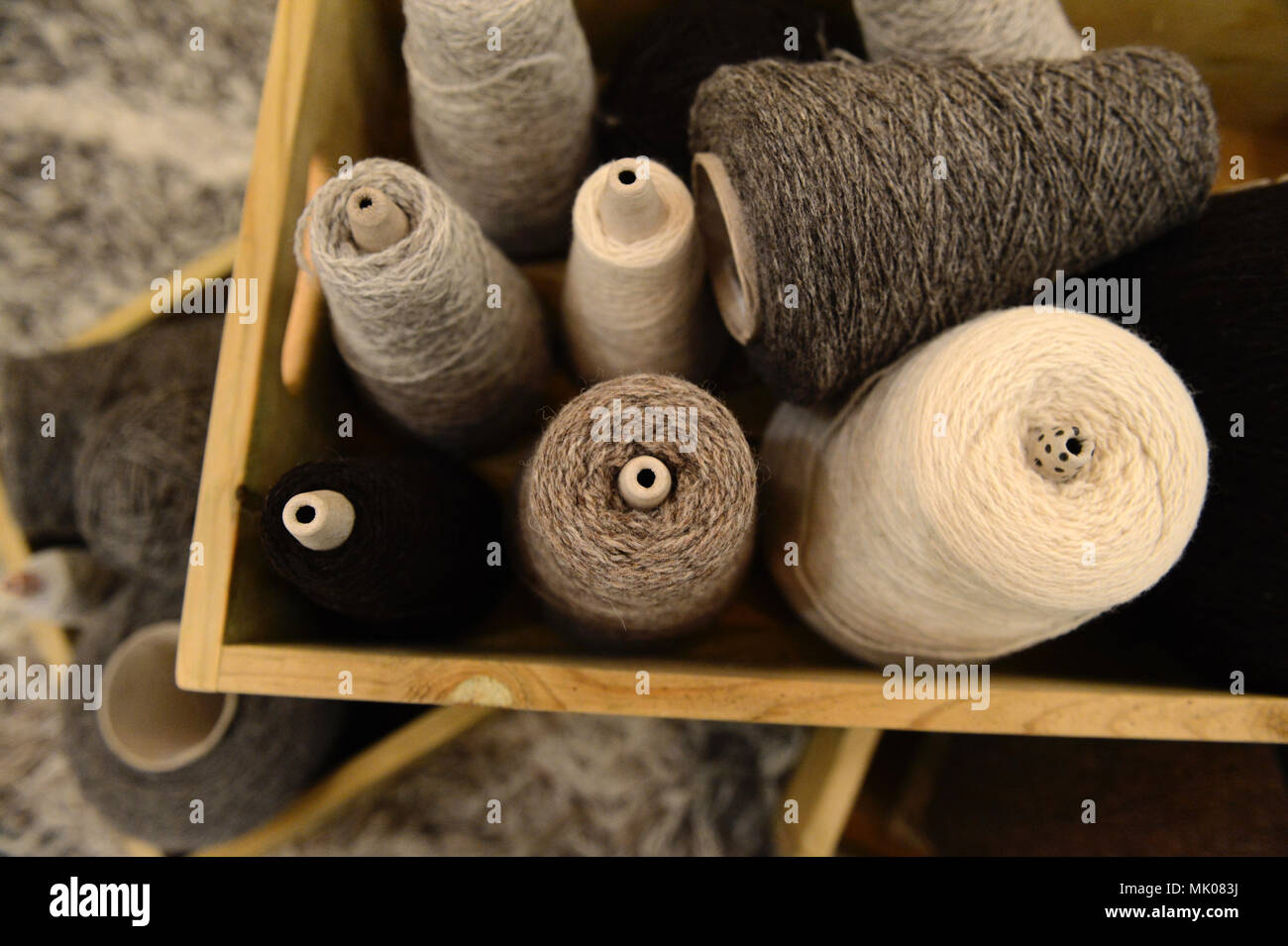 Balls and cones of naturally dyed Shetland wool that are the colours of ...