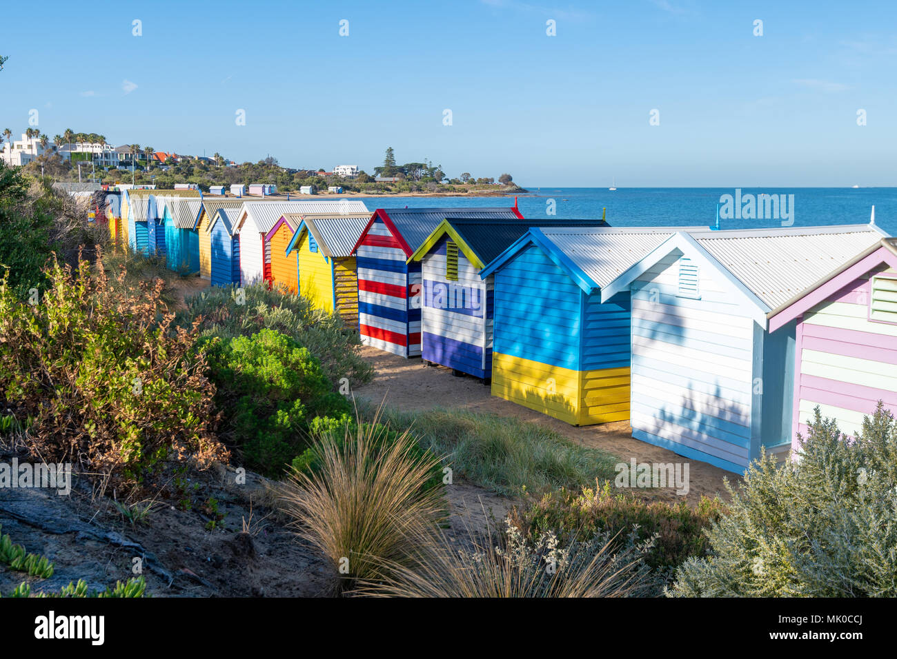 Bright and colourful wood beach bathing huts on Brighton Beach close to ...