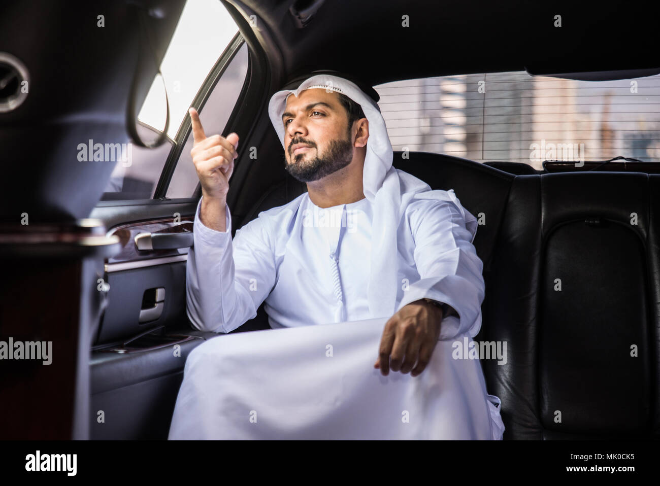 Arabic businessman wearing kandora - Portrait of traditional emirati ...