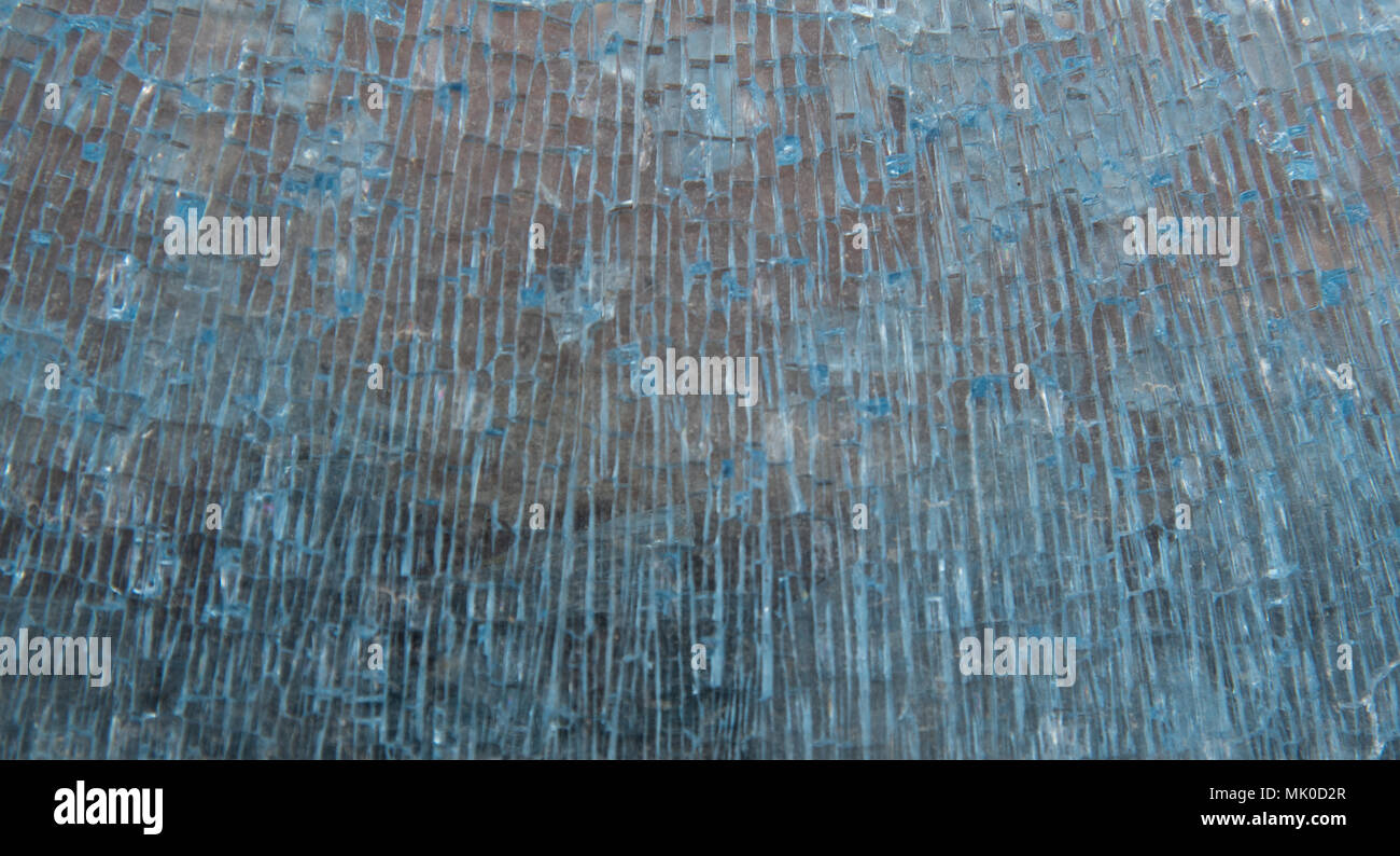 Broken blue crystal glass background. Graphic textures from a broken ...